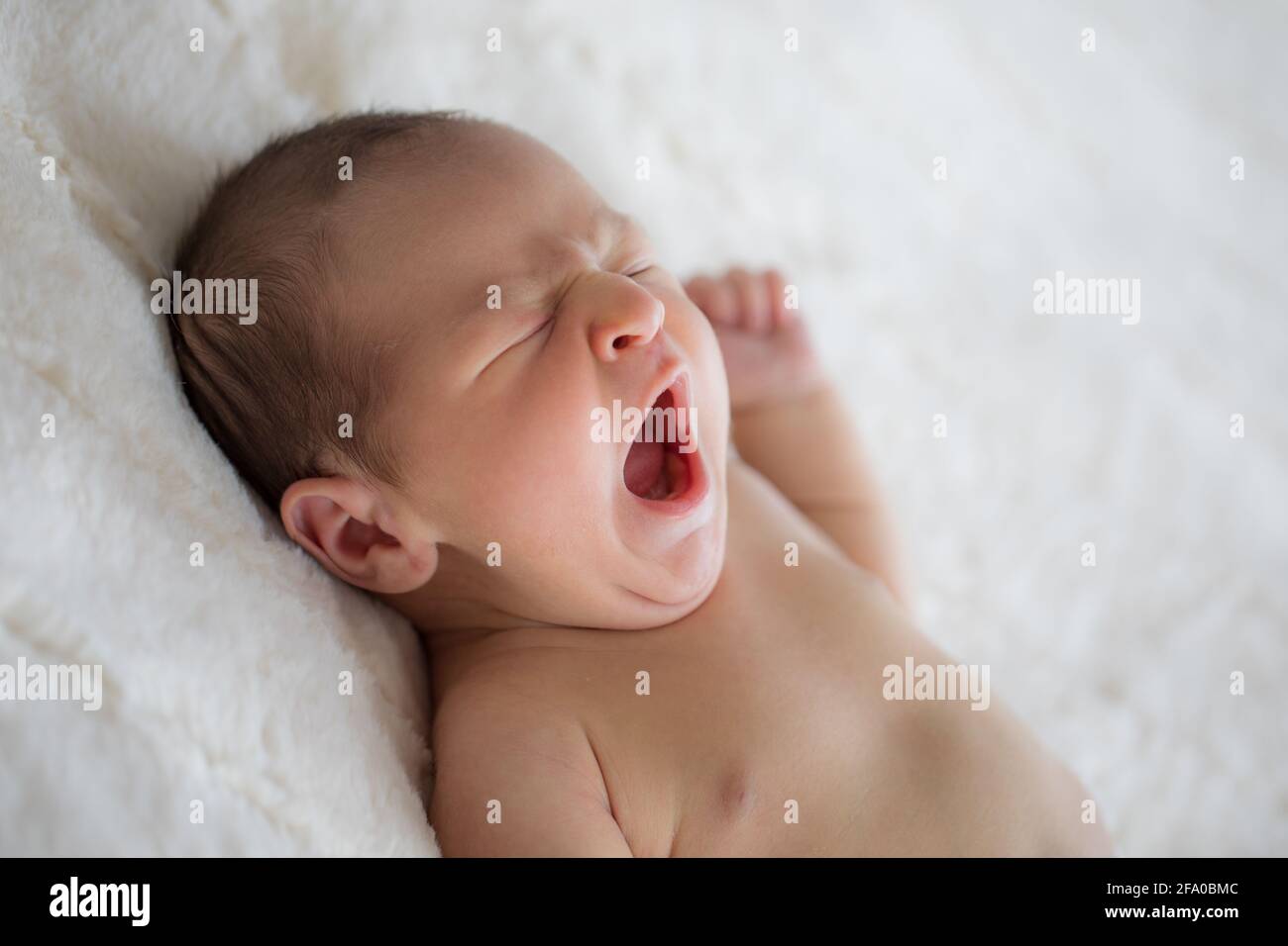 A Newborn baby yawning Stock Photo - Alamy