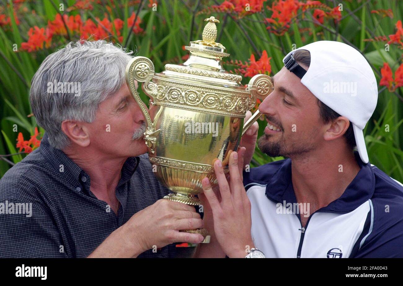 GORAN IVANISEVIC AND DAD SRDJAN KISS THE TROPHY AT WIMBLEDON TENNIS ...