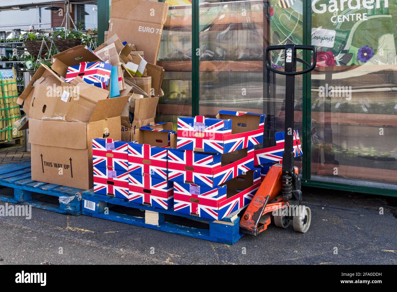 Empty produce boxes outside a UK supermarket sporting Union Jack livery ...