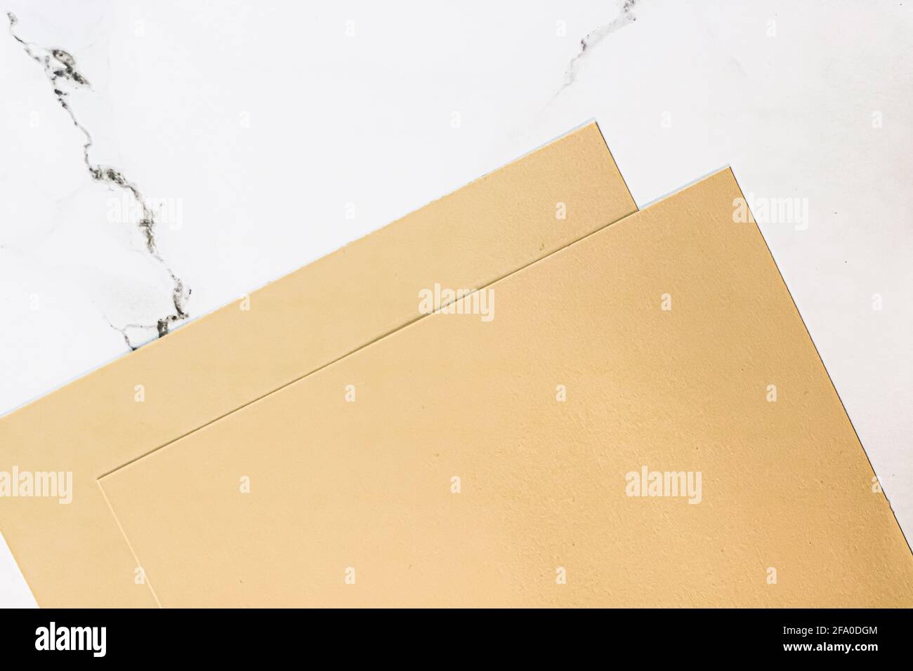 Beige A4 papers on white marble background as office stationery flatlay ...