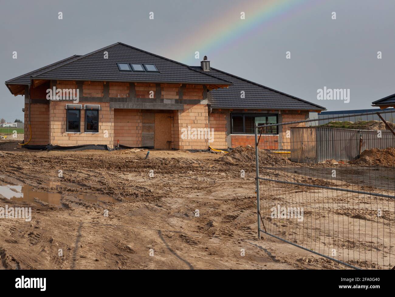 Almost finished new house construction made of red brick Stock Photo ...