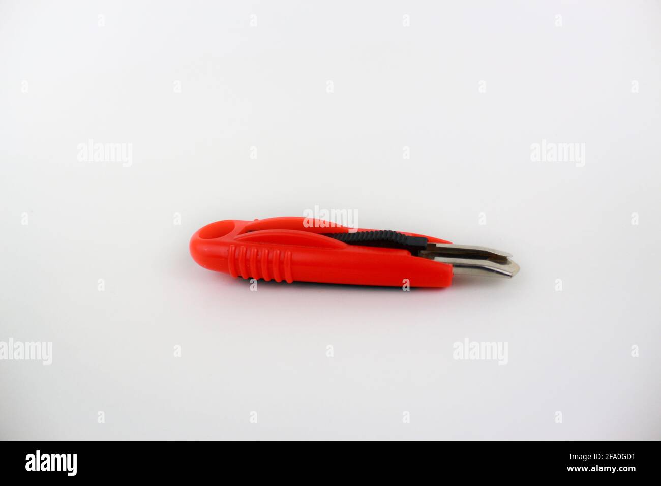 Red cutter isolated on white background Stock Photo - Alamy