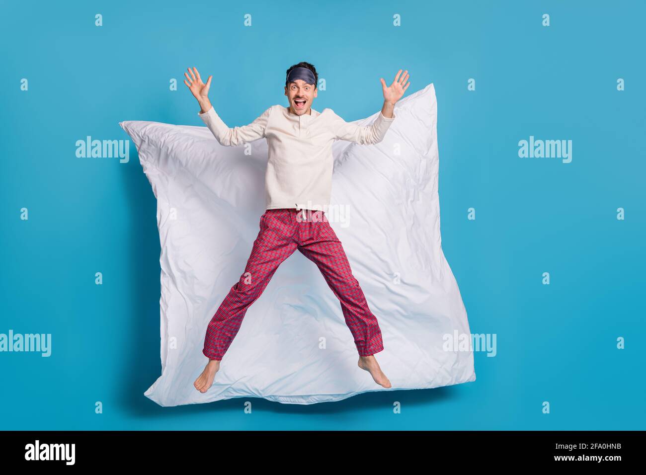 Full length photo portrait of shocked guy jumping up with blanket in ...