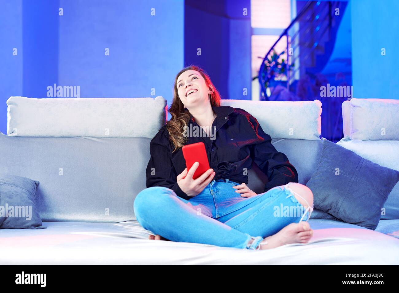girl making plans for the future on the couch Stock Photo - Alamy