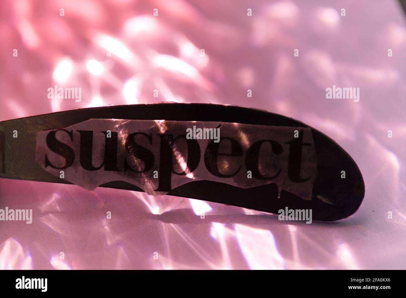 Black and White abstract close-up of printed word ' Suspect ...