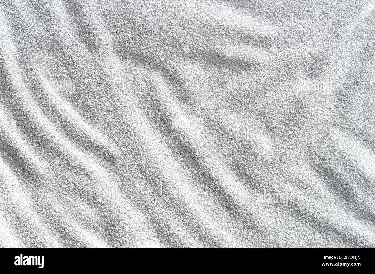 A flat background of coarse ground pumice, lit to show maximum texture ...