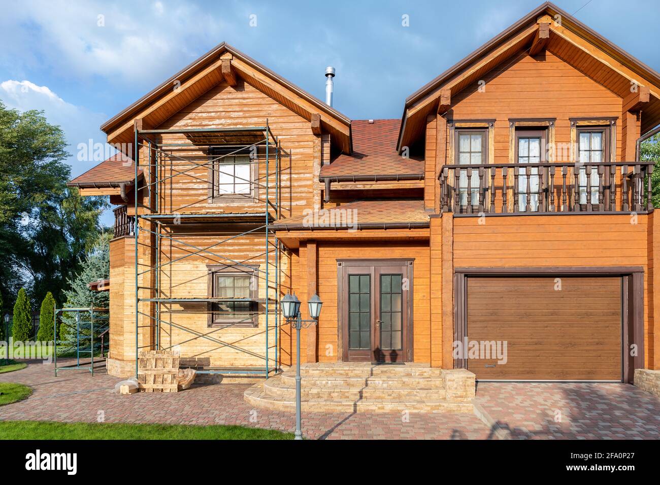 Modern wooden timber eco house villa facade during process of ...