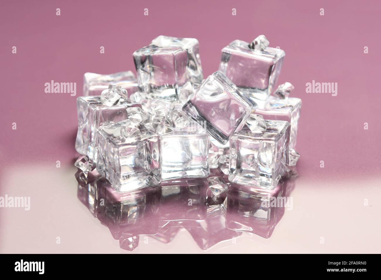 ice stone on reflective surface of background with drops, idea of a ...