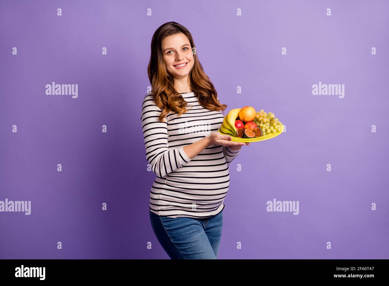 Photo of adorable sweet woman expecting child wear striped shirt belly ...