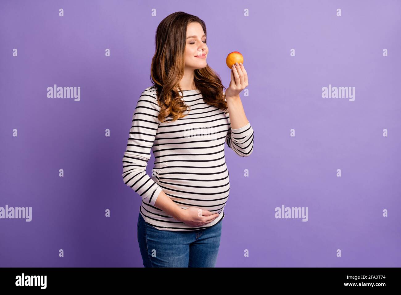 Photo of pretty dreamy lady waiting baby dressed striped shirt arm ...