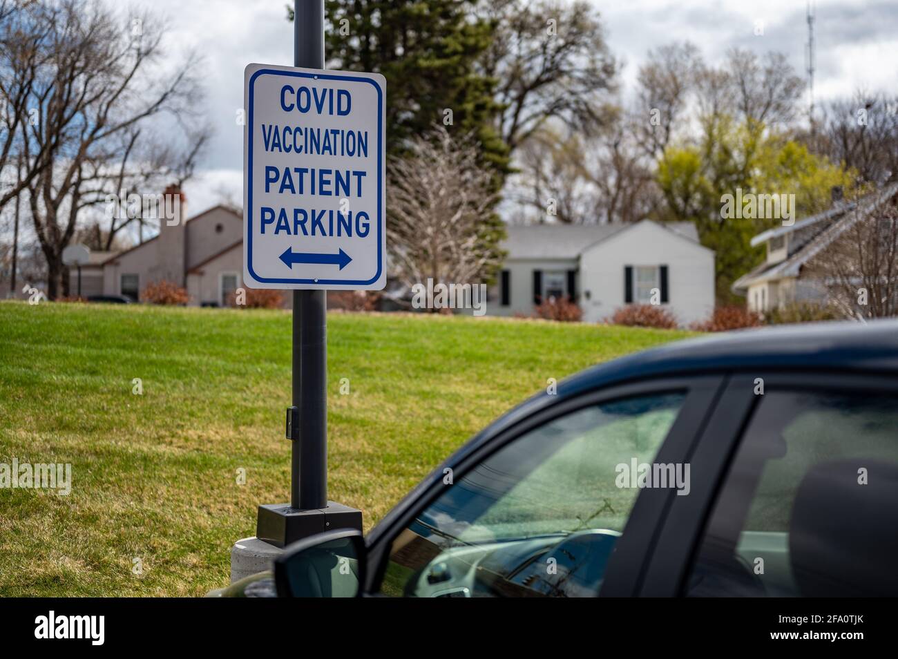 COVID vaccination sign in front of hospital with empty spaces Stock ...
