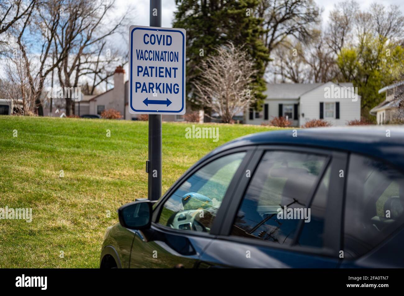 COVID vaccination sign in front of hospital with empty spaces Stock ...