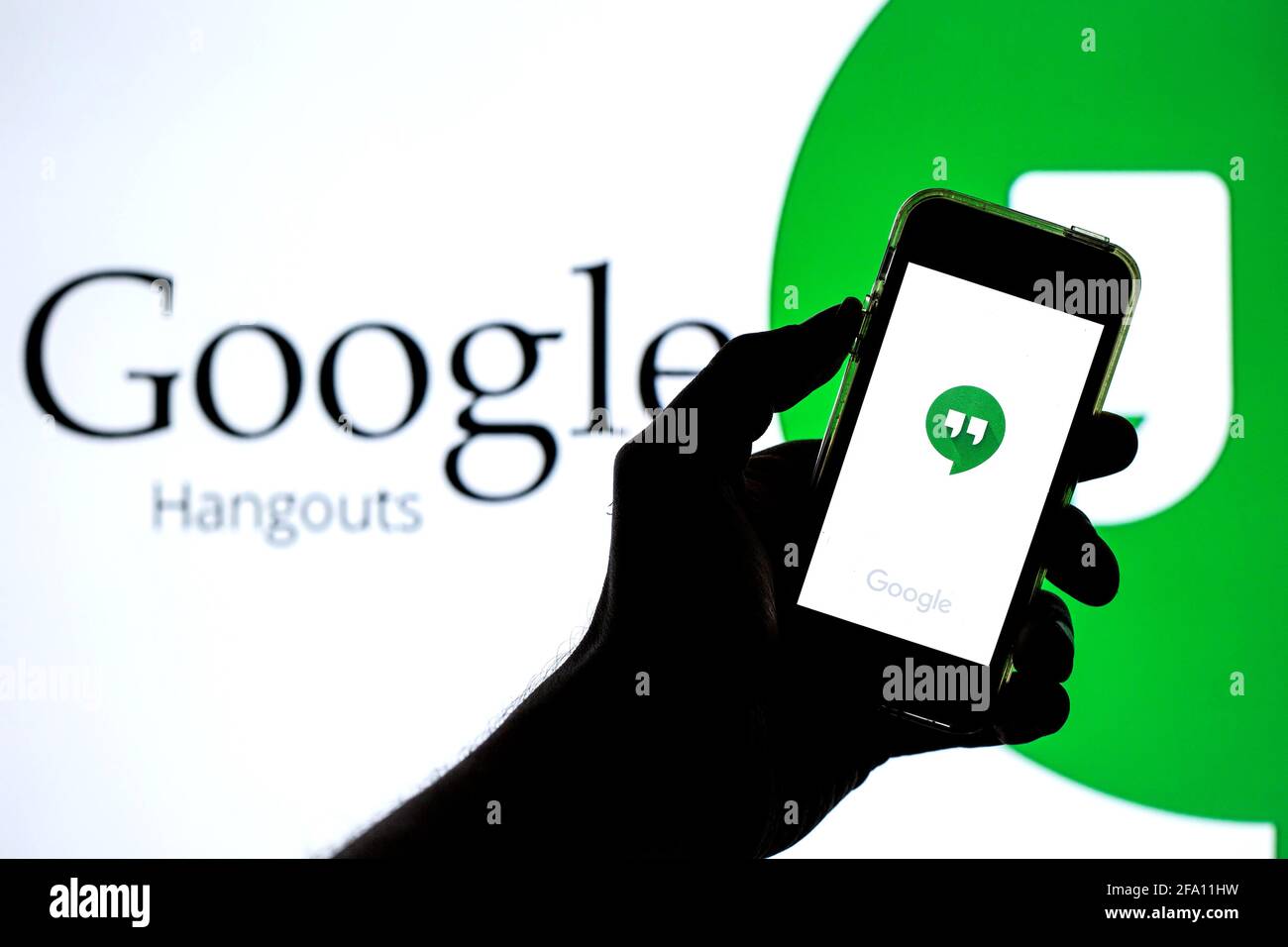 In this photo illustration a Google Hangouts app seen displayed on a ...
