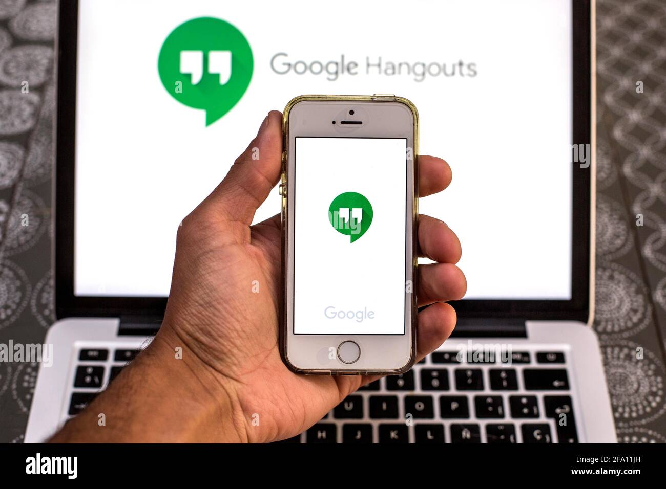 In this photo illustration a Google Hangouts app seen displayed on a ...