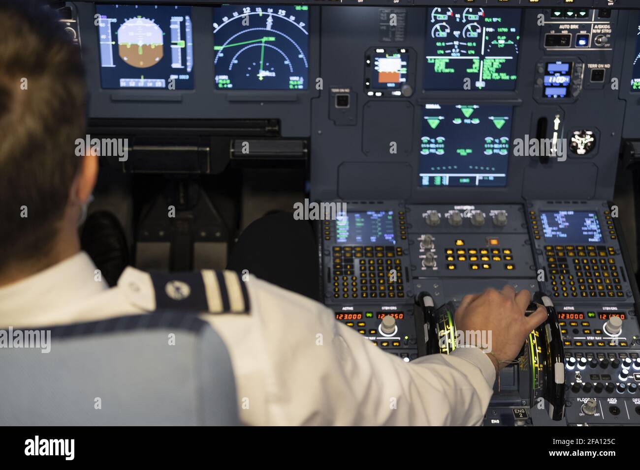 Commercial flight simulator starting takeoff while the pilot operates ...