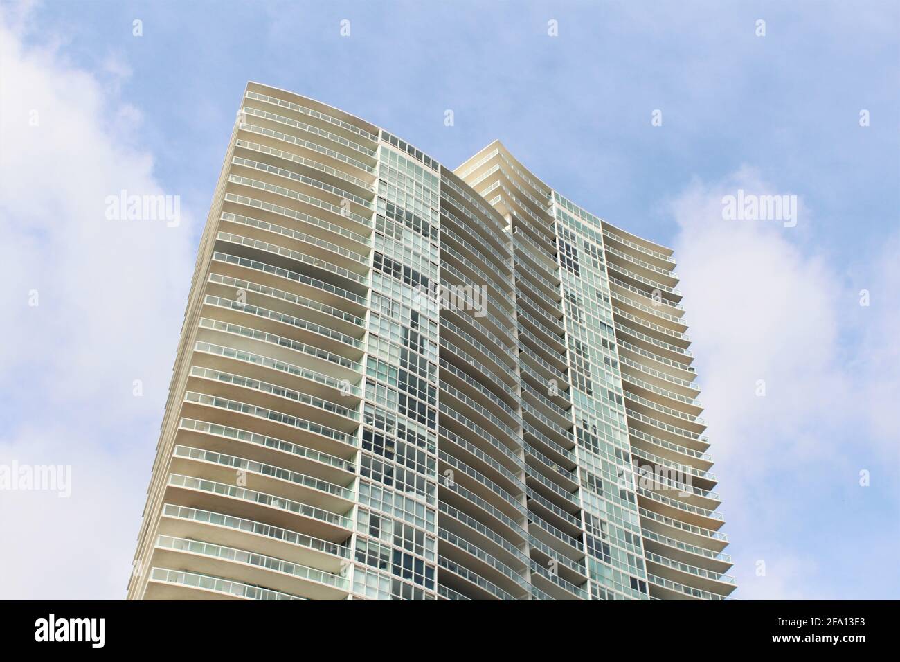: Tall condominium building in Miami, Florida. Skyrise with clear skies ...