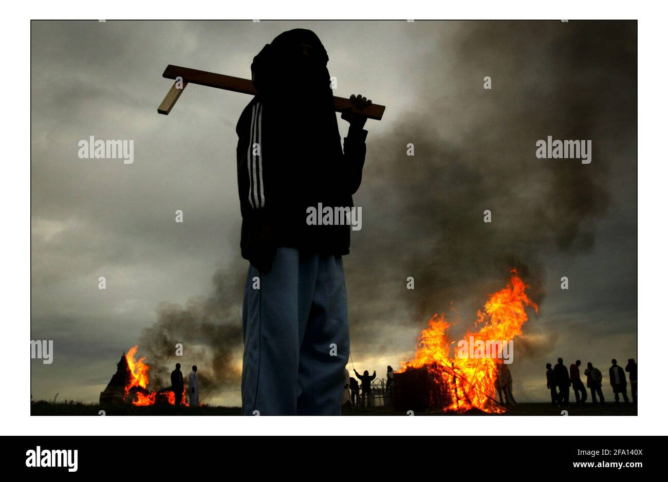 Darfur survivors Re enact the burning and destruction of a mock village ...