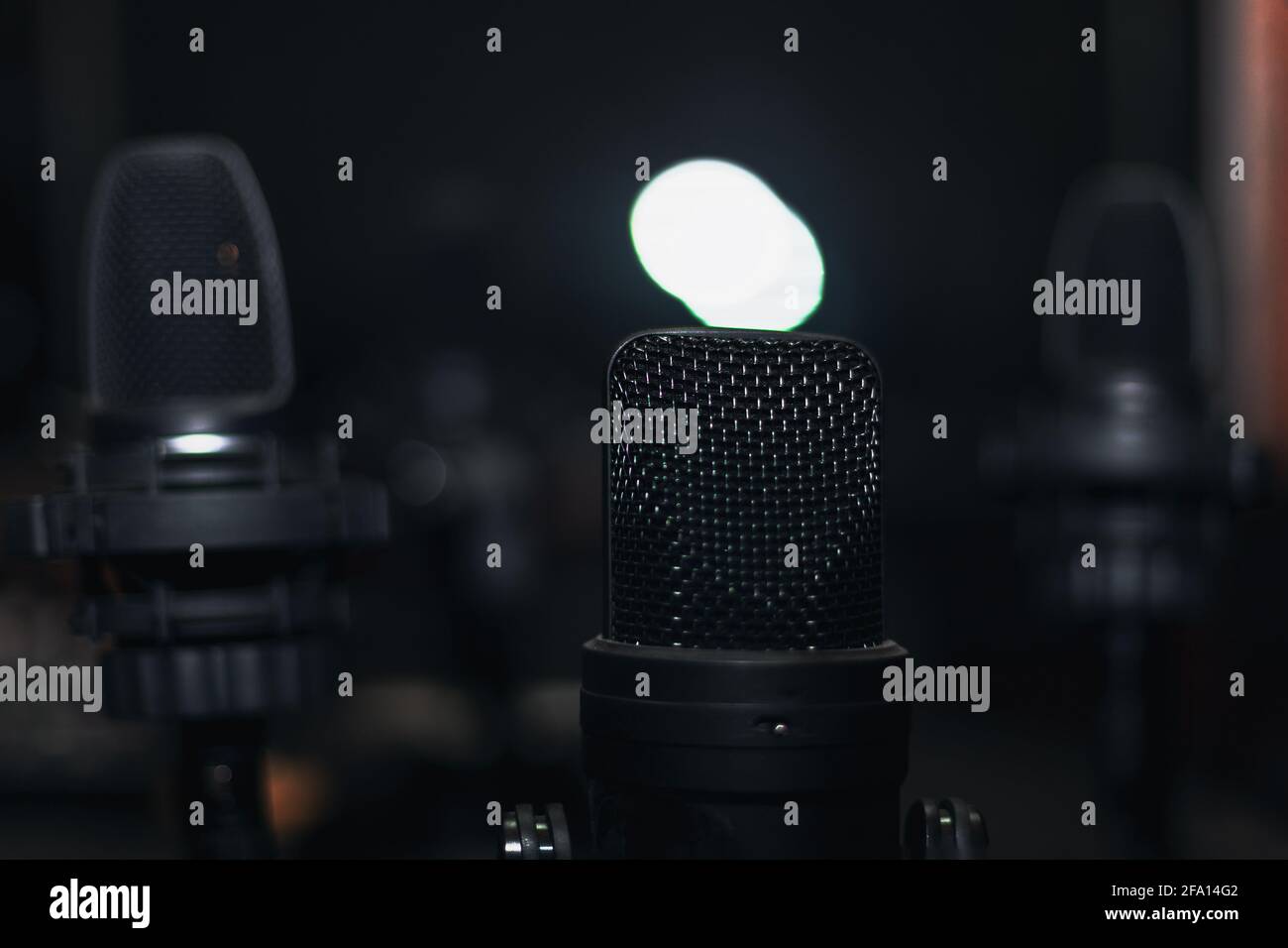 Black microphones in the dark studio Stock Photo - Alamy