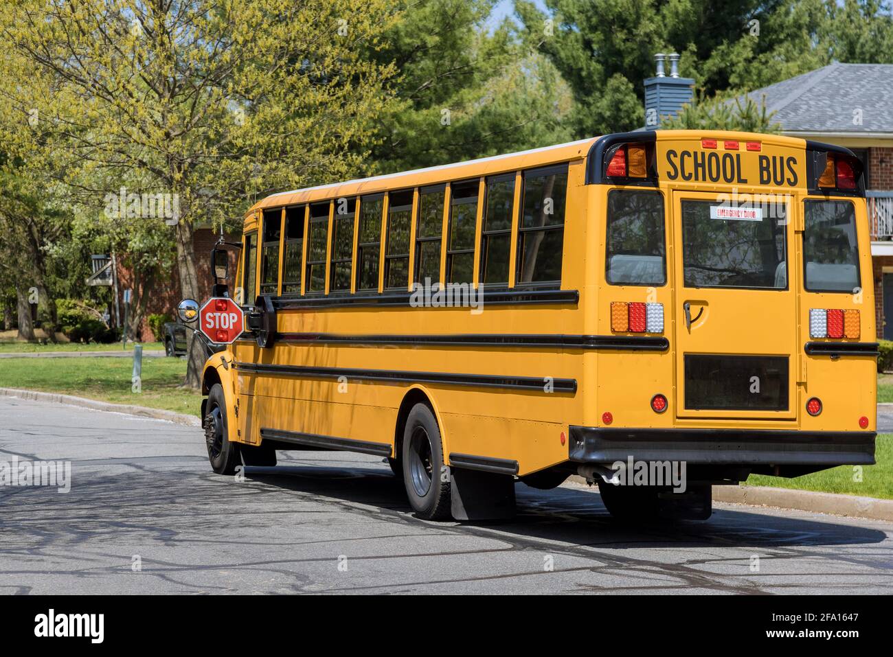 School bus on american town road in the morning Stock Photo - Alamy
