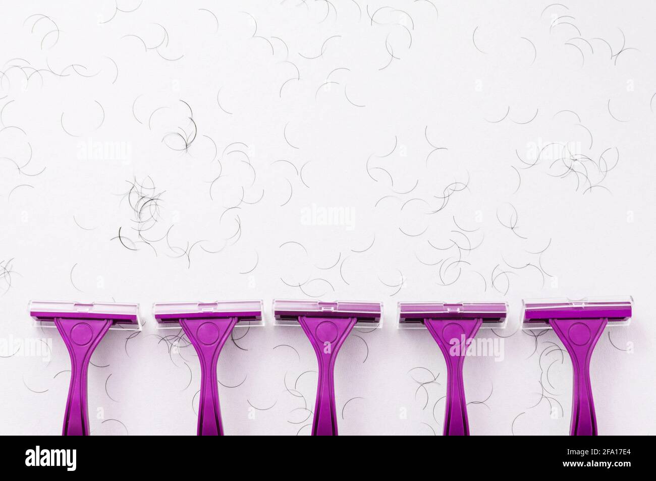 Purple shaving machine on a white background. The concept of hygiene ...