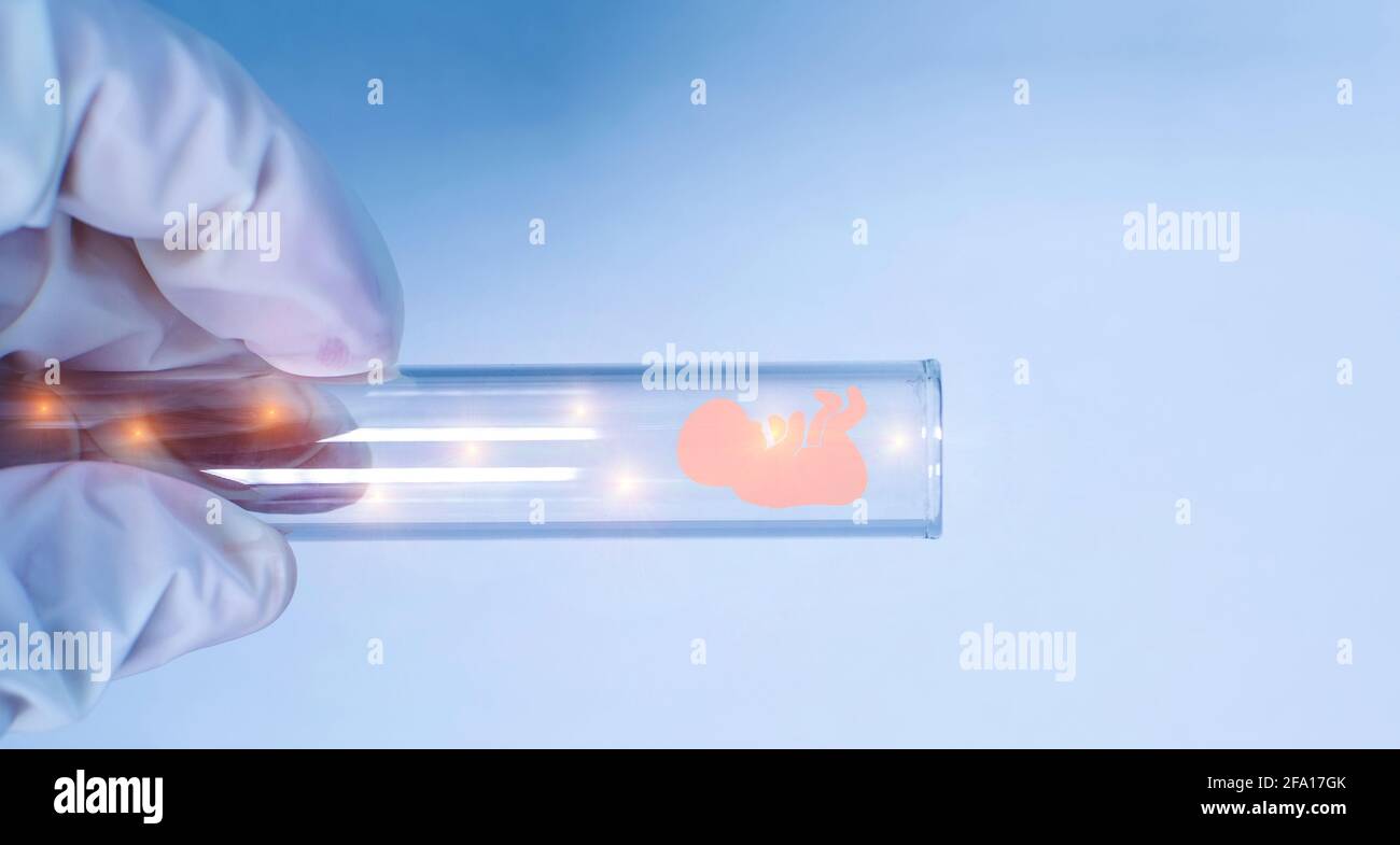 Medical laboratory. The doctor's gloved hand holds a test tube with a ...