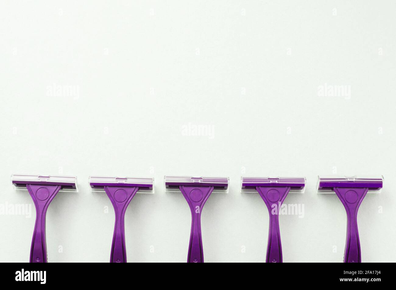 Purple shaving machine on a white background. The concept of hygiene ...