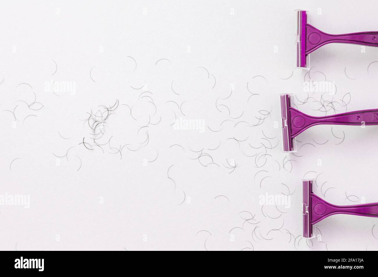 Purple shaving machine on a white background. The concept of hygiene ...
