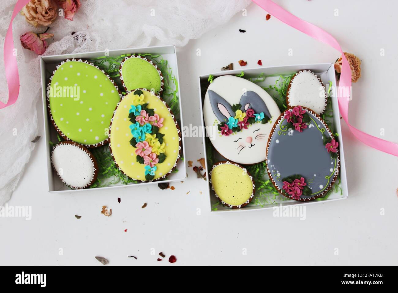 Easter colorful gingerbread in the shape of an egg with a rabbit drawn ...