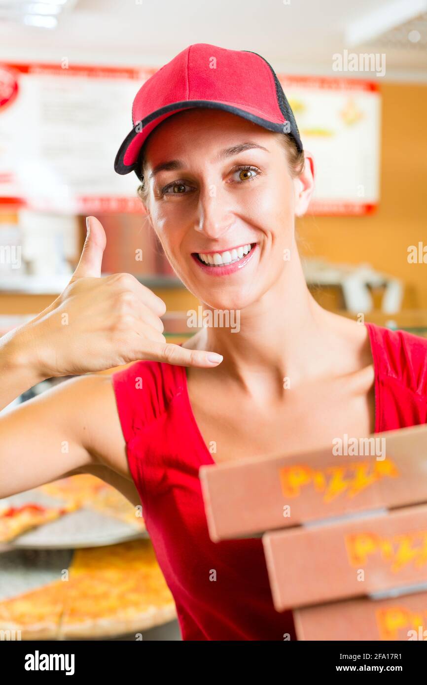 Woman holding several pizza boxes in hand and asking you to order pizza ...