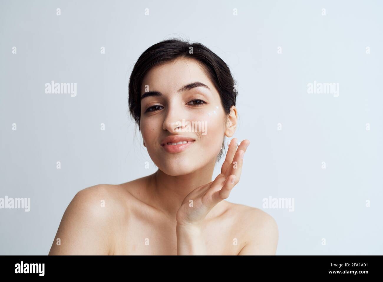 Beautiful brunette clean skin care face dermatology cream Stock Photo ...