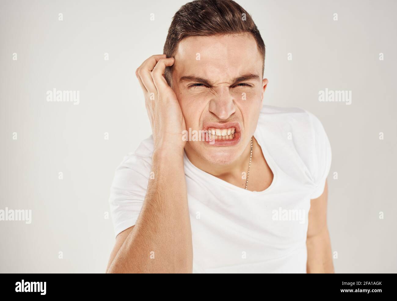 Nervous man touches his head stress Model of emotion Stock Photo - Alamy