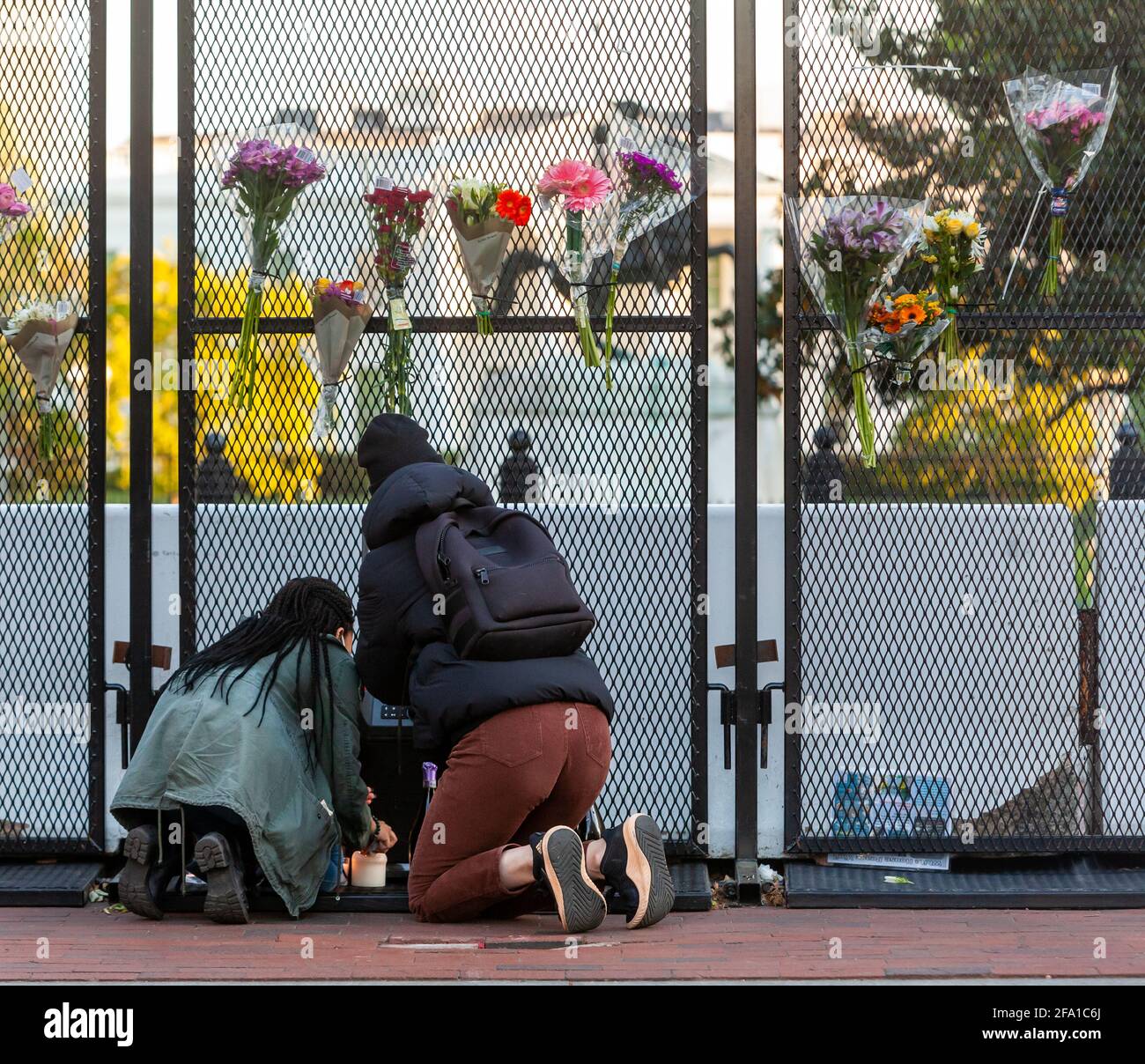Washington, DC, USA, 21 April, 2021. Pictured: Two women place flowers ...