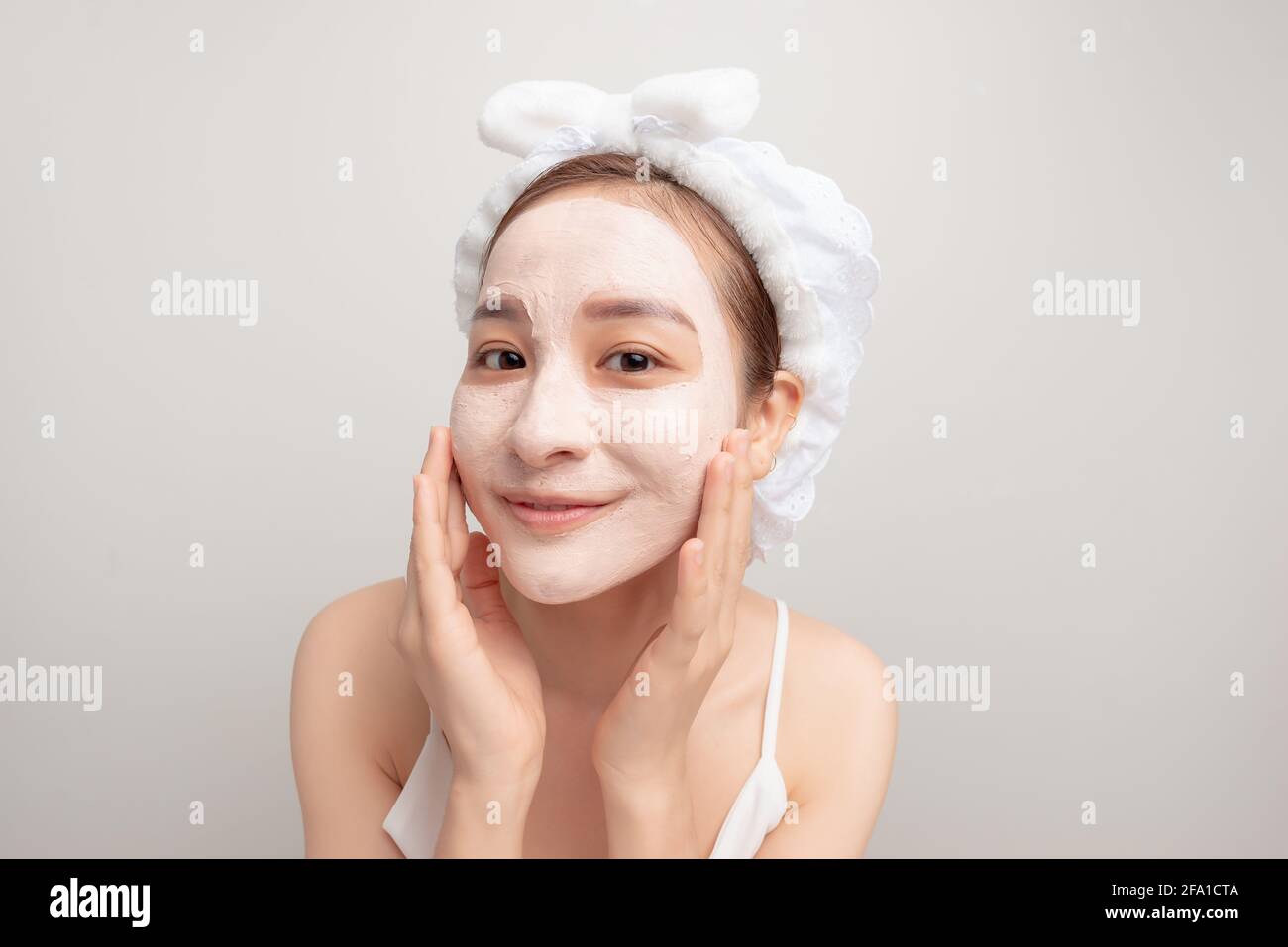 a woman put a mask on her face after a shower Stock Photo - Alamy