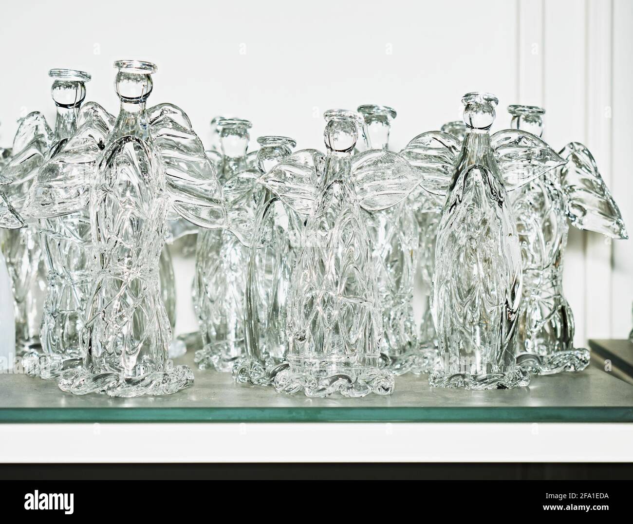 Group of crystal angels and figures with wings. Artistic object made by ...