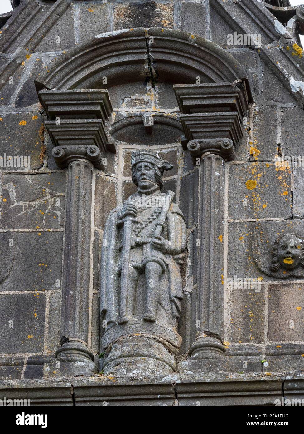 Pediment, statue of Saint Miliau seated. in a niche formed by Ionic ...