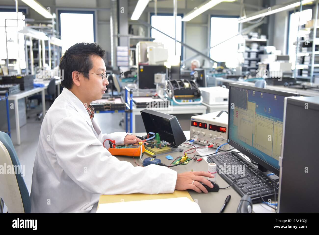 engineer at the workplace - assembly and development of electronics in ...