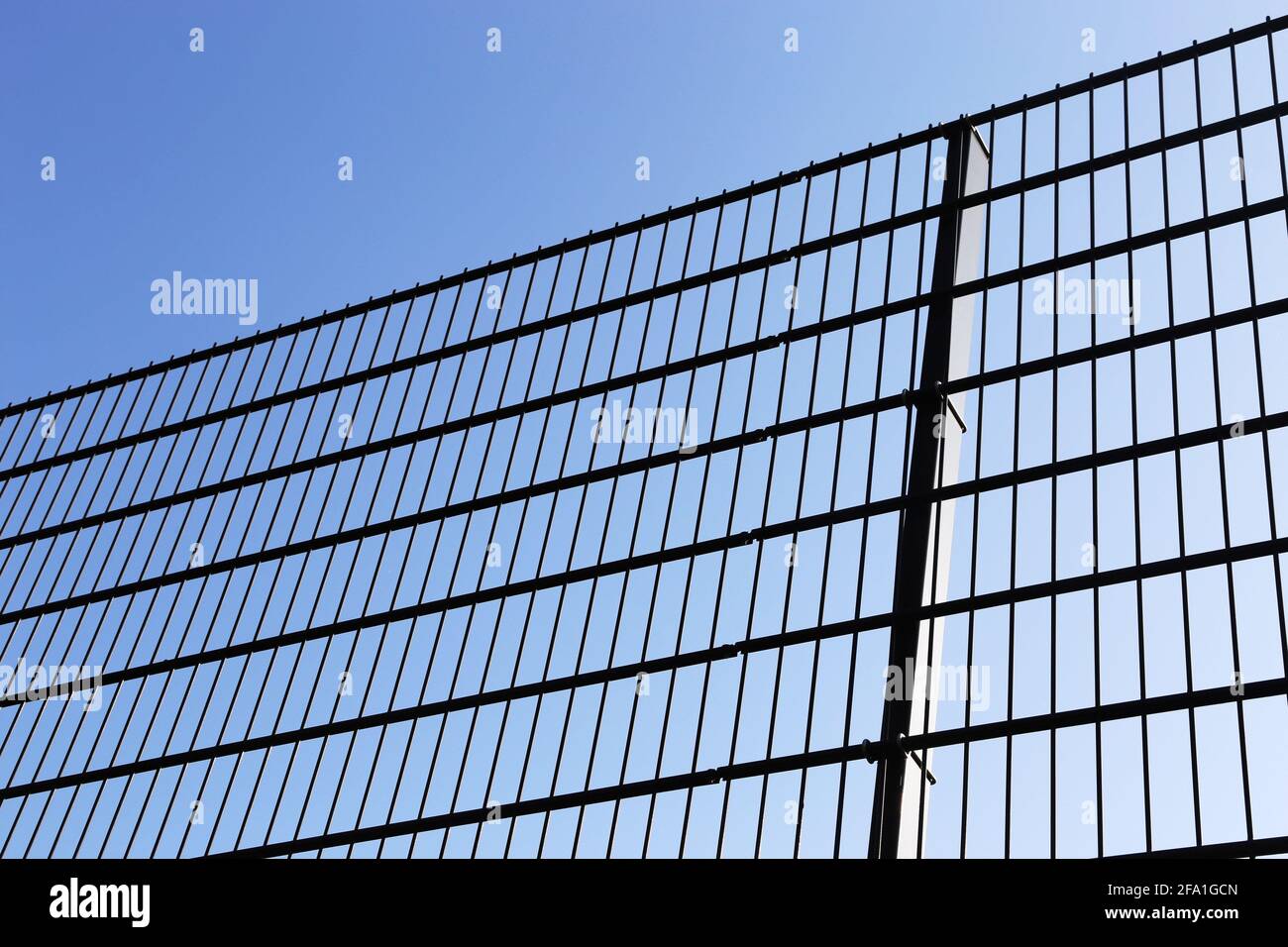 New garden fence as property fence line Stock Photo - Alamy