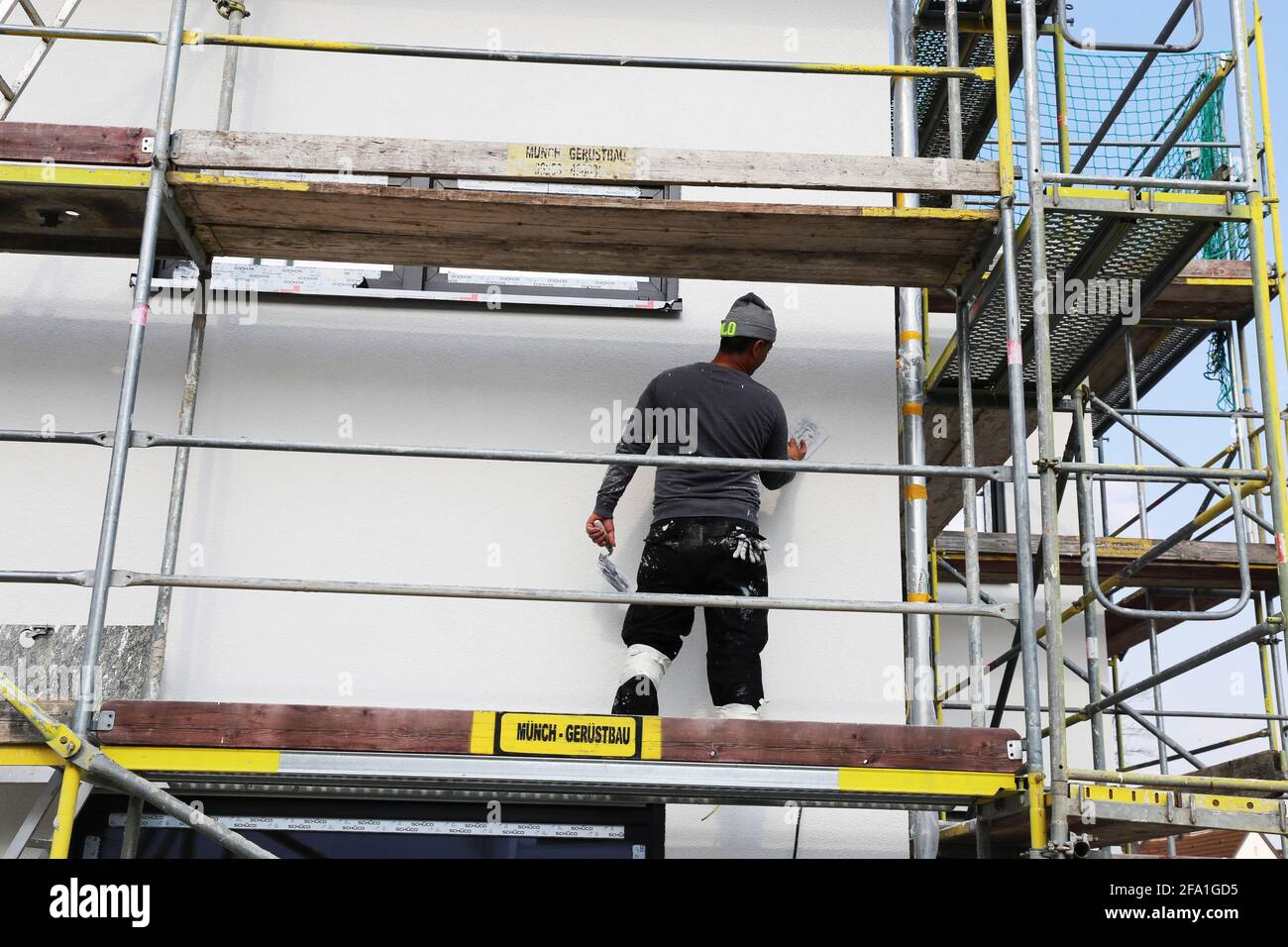 On scaffolding plastering wall new hi-res stock photography and images ...