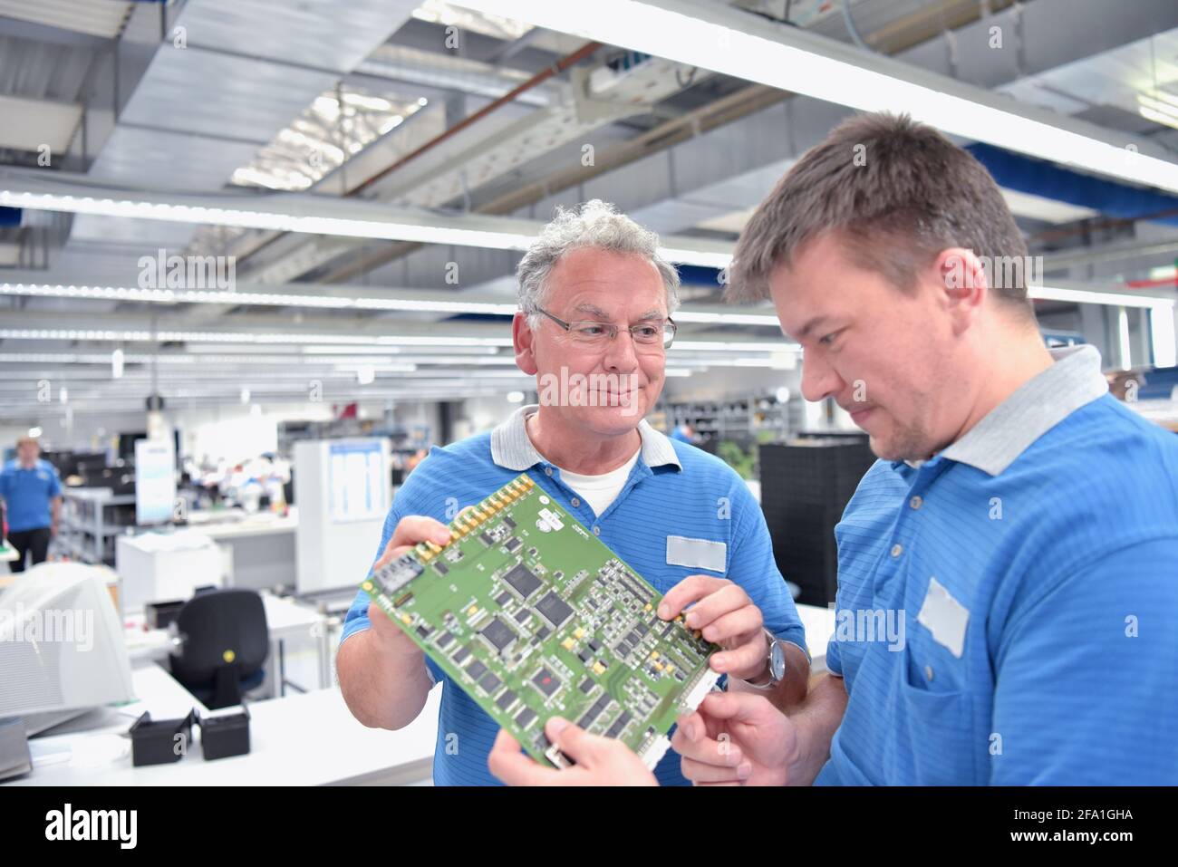 quality control in engineering in teamwork - employees at a meeting ...