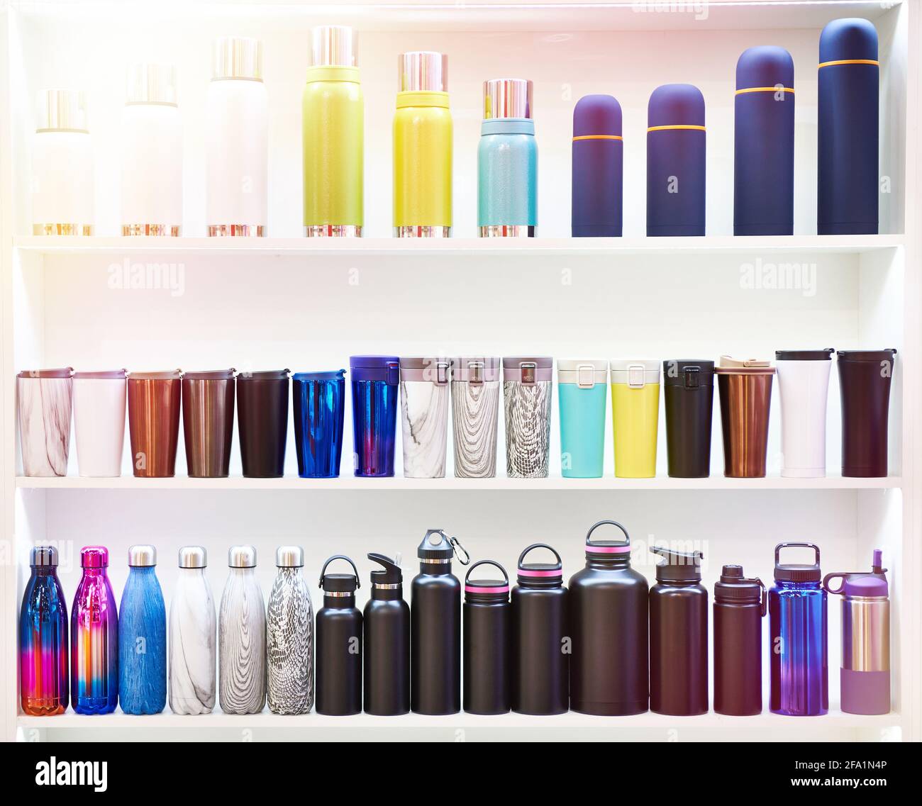 Colored thermos in the shop window Stock Photo - Alamy