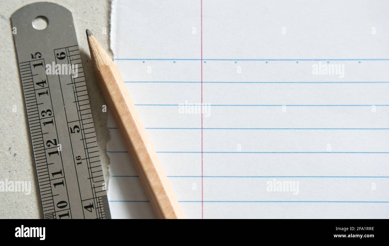 lined paper, pencil and ruler Stock Photo - Alamy