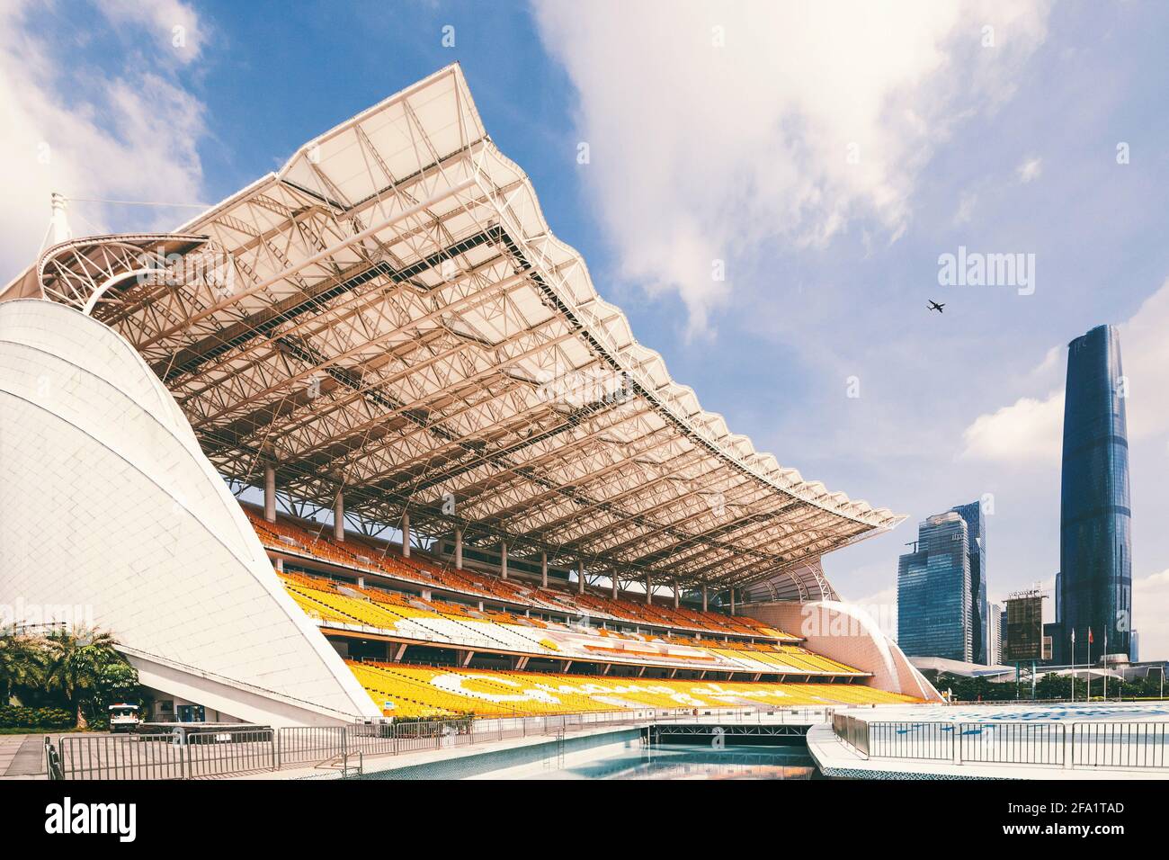 Modern soccer stadium with yellow seats in an urban city Stock Photo ...