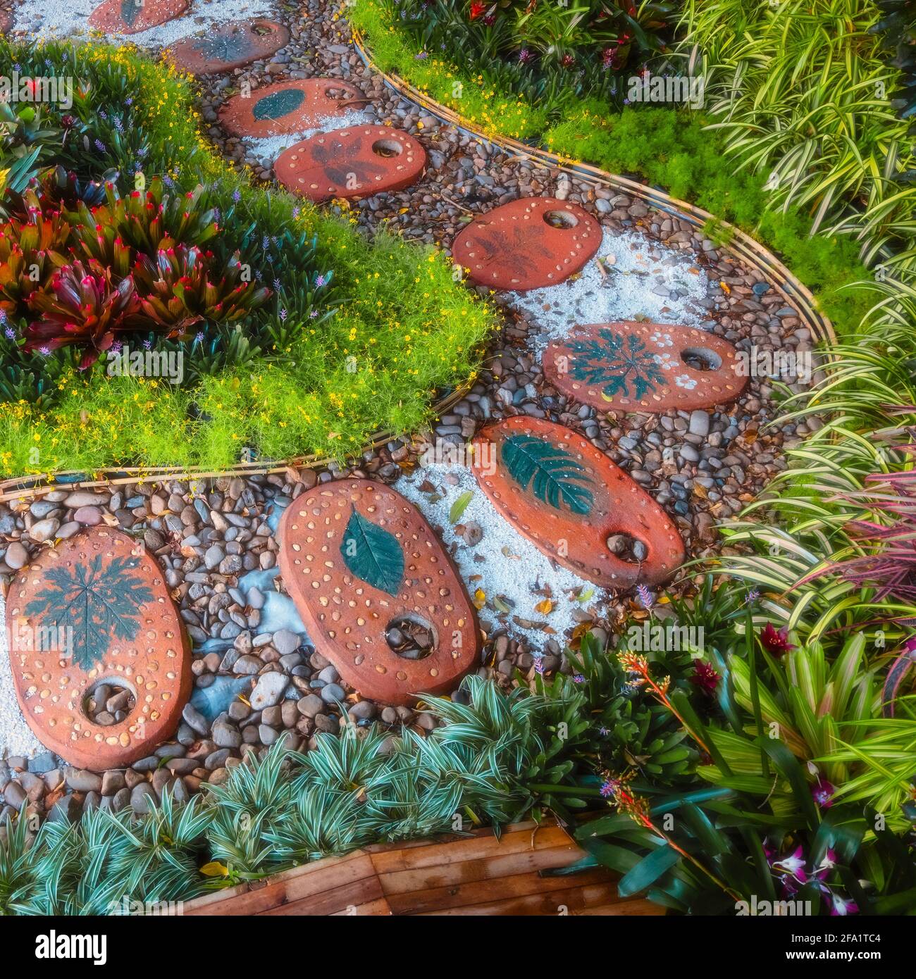 Stepping Stones in a Garden with Plants and Trees Stock Photo - Alamy