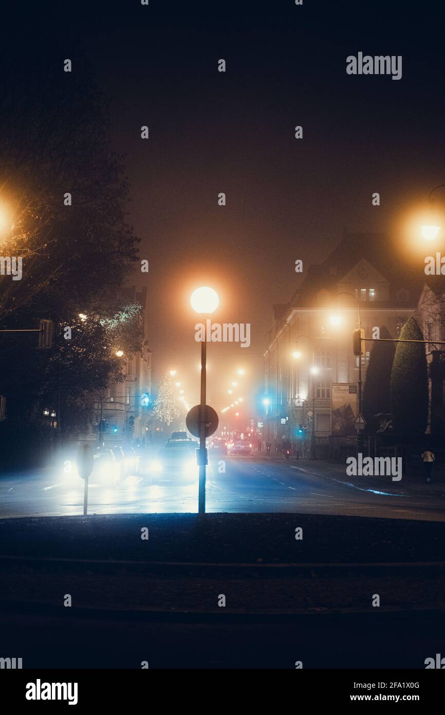 Avenue (road) during a rainy night in Munich, Bavaria, Germany. Traffic ...