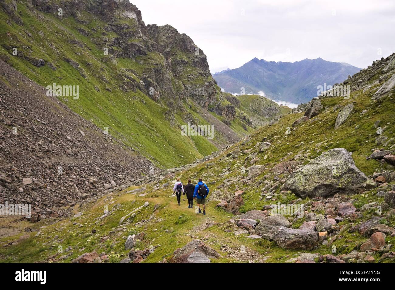 Trentino, Italy - 20 August 2020, a group of people is hiking a ...