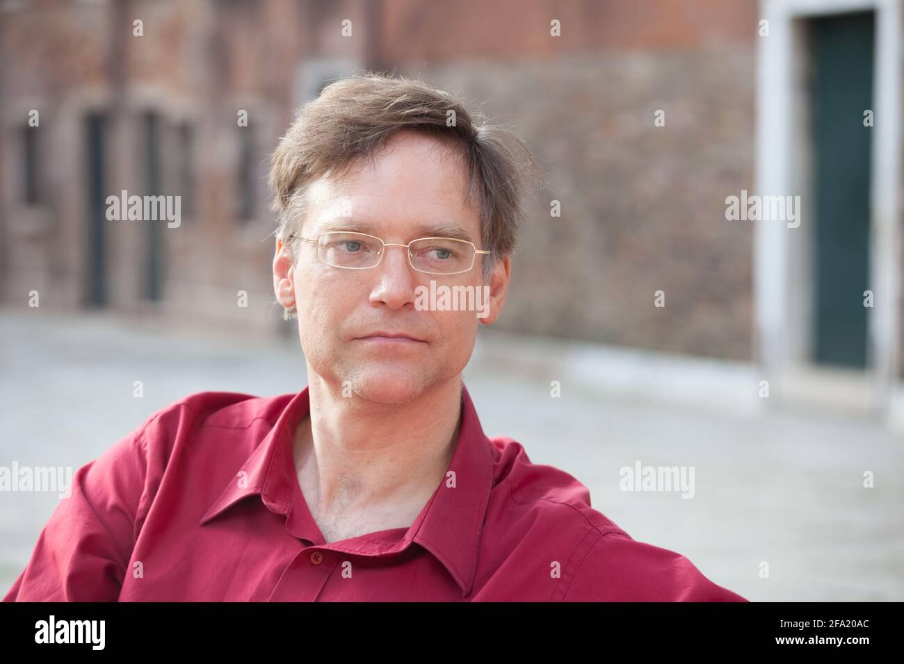 Man in red shirt hi-res stock photography and images - Alamy