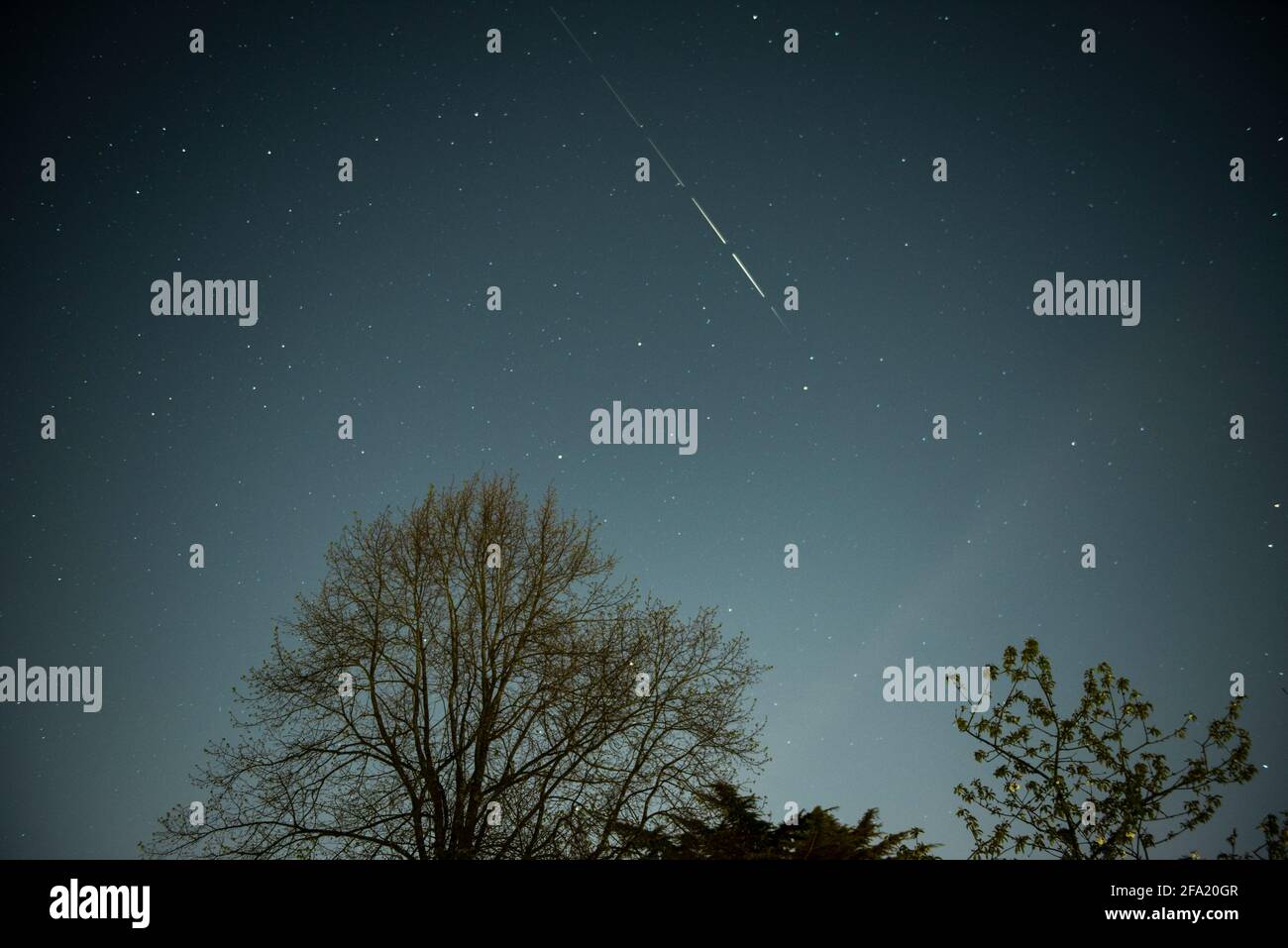 London, UK. 22 April 2021. A composite image shows a satellite trail ...