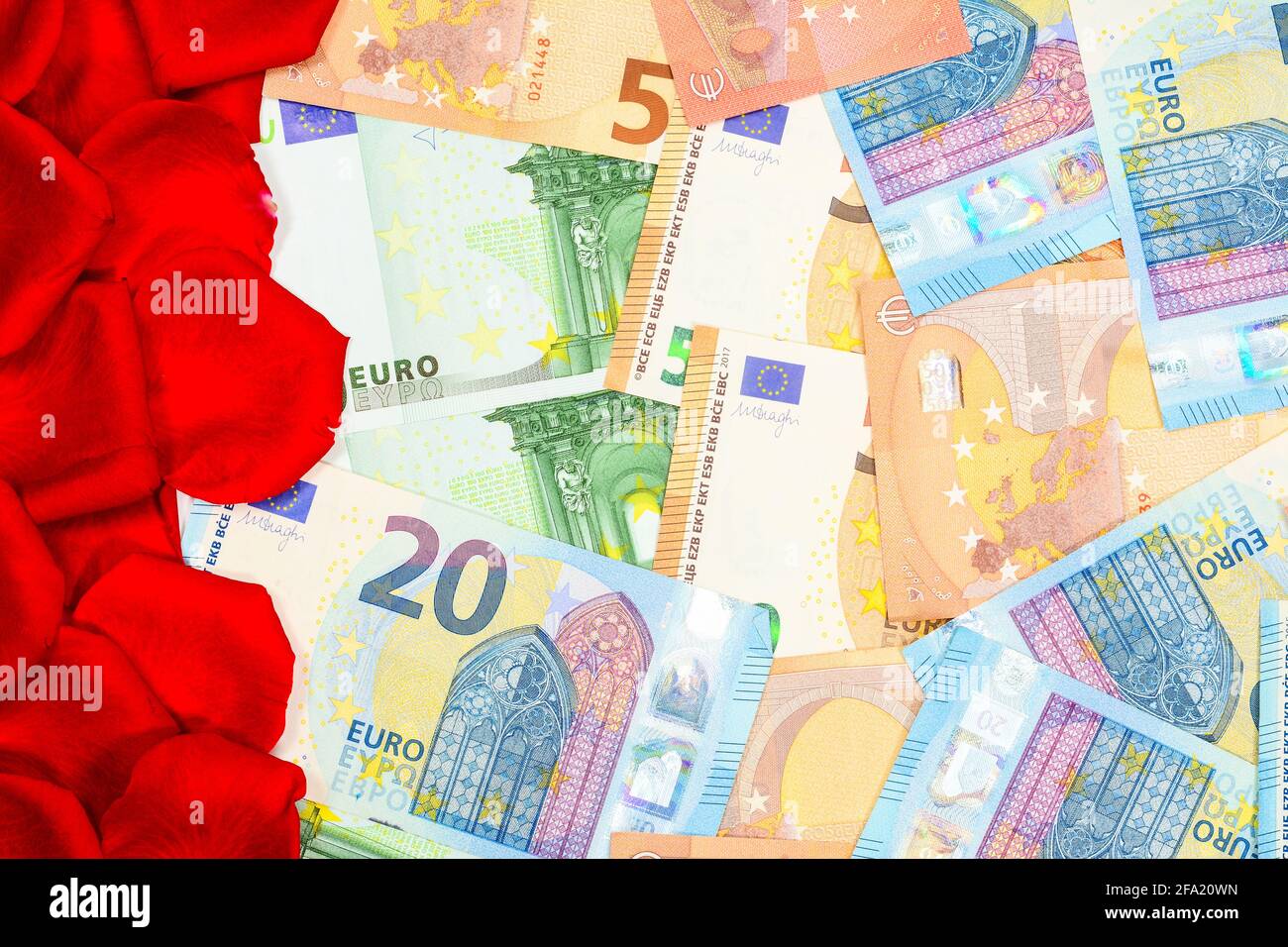 Background from euro banknotes of different values with a border of red ...