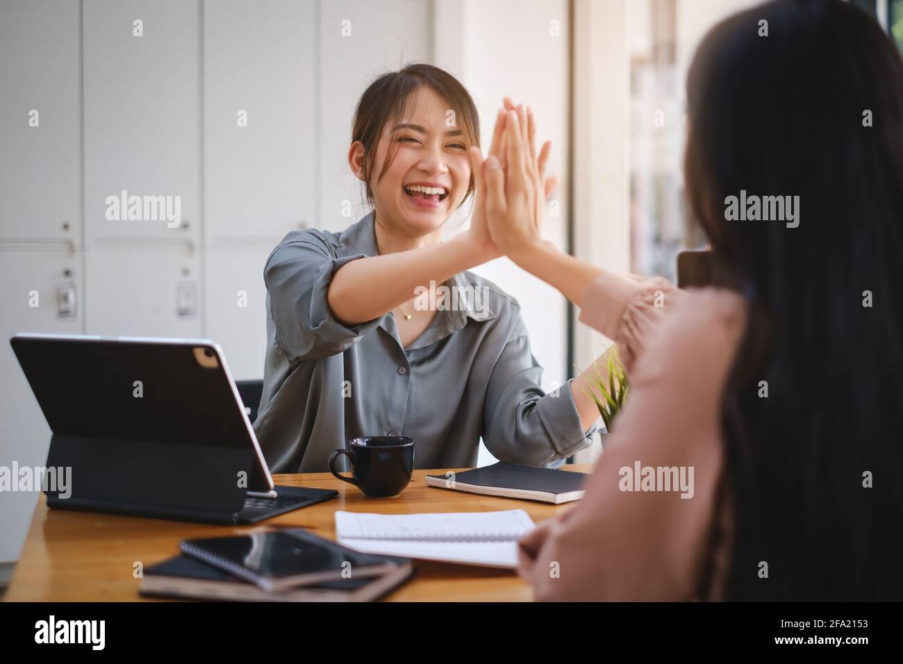 Business start up with team happy with the reward giving for her ...