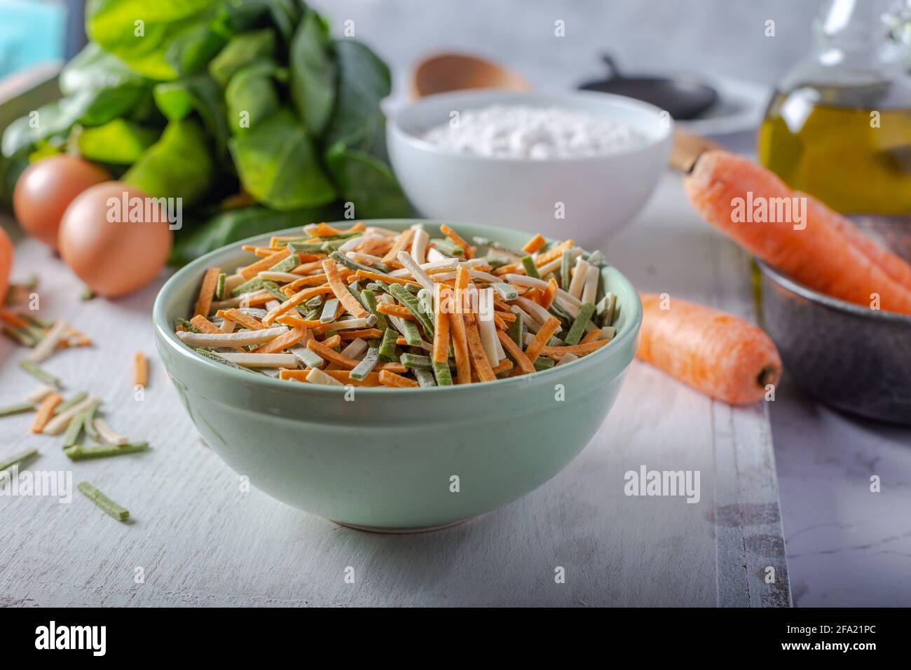 Homemade fresh noodles with vegetables. Raw noodle with sweet beet and ...